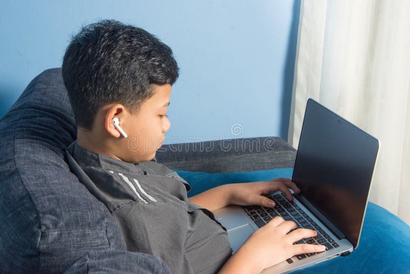 Asian Boy Using Laptop Computer, Side View Stock Photo - Image of ...