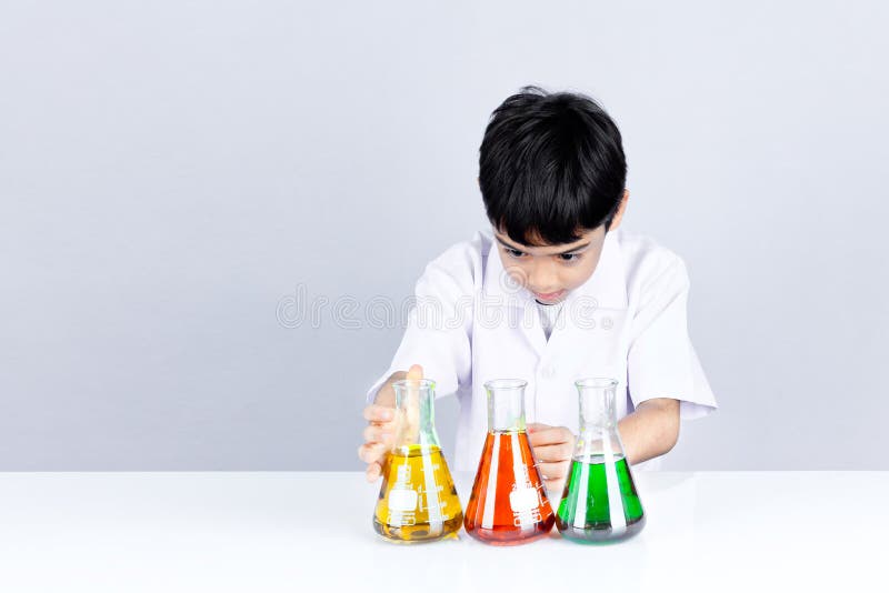 Asian Boy is Viewing Test Color Combination on Science Experiment ...