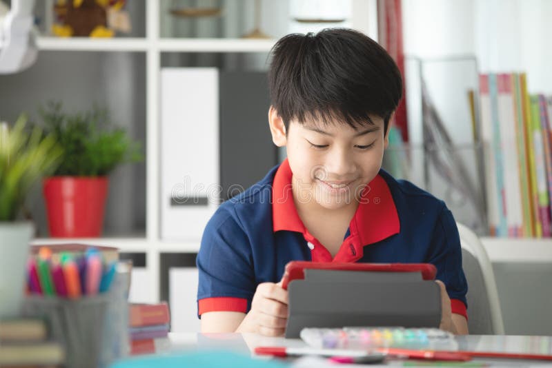 Asian Boy Watching on Tablet Computer ,smile Face . Stock Image - Image ...