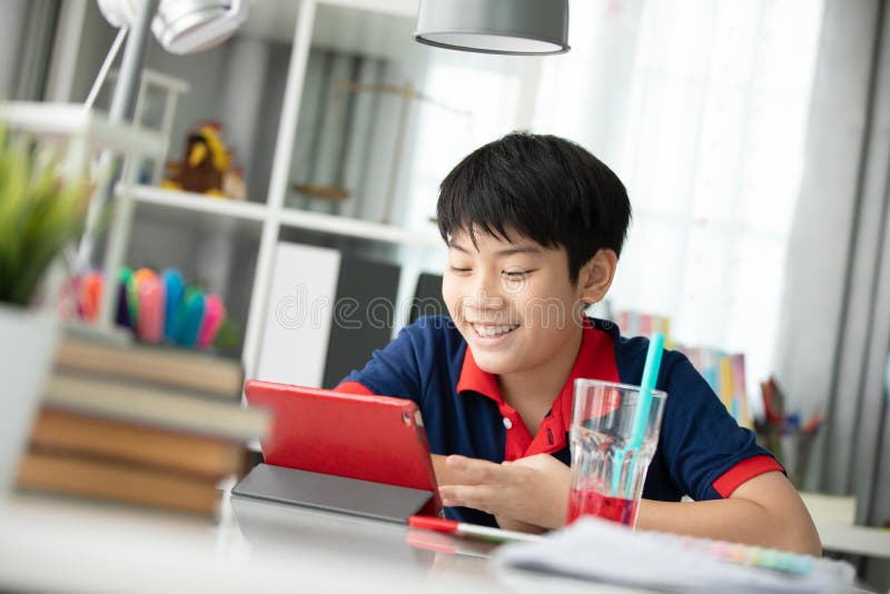 Asian Boy Watching on Tablet Computer ,smile Face . Stock Photo - Image ...