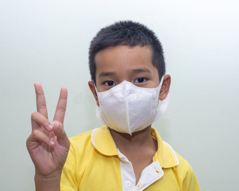 Asian Boy Wears a Protective Mask. COVID-19. Stock Image - Image of ...