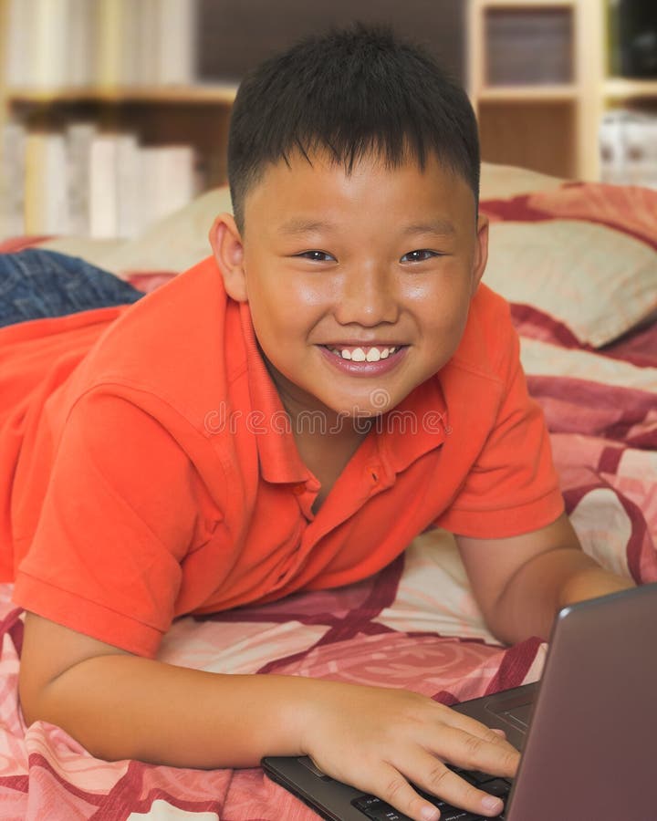 Asian Boy Working on a Laptop Computer Stock Photo - Image of chinese ...