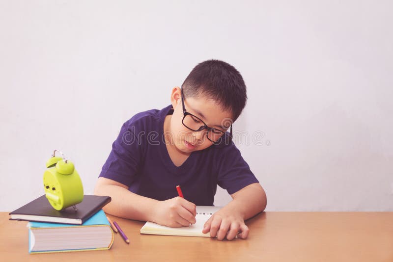 Asian Boy Writeing a Book on Table Stock Image - Image of notebook ...
