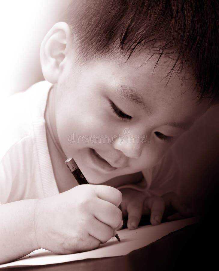Asian boy writing on paper stock photo. Image of concentrate - 13140864