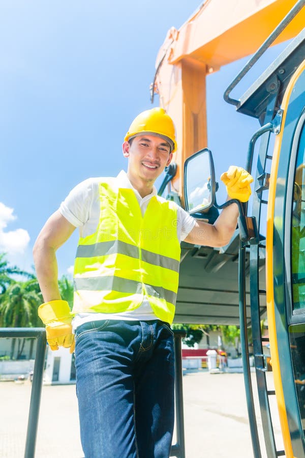 Asian Builder with Excavator on Construction Site Stock Image - Image ...