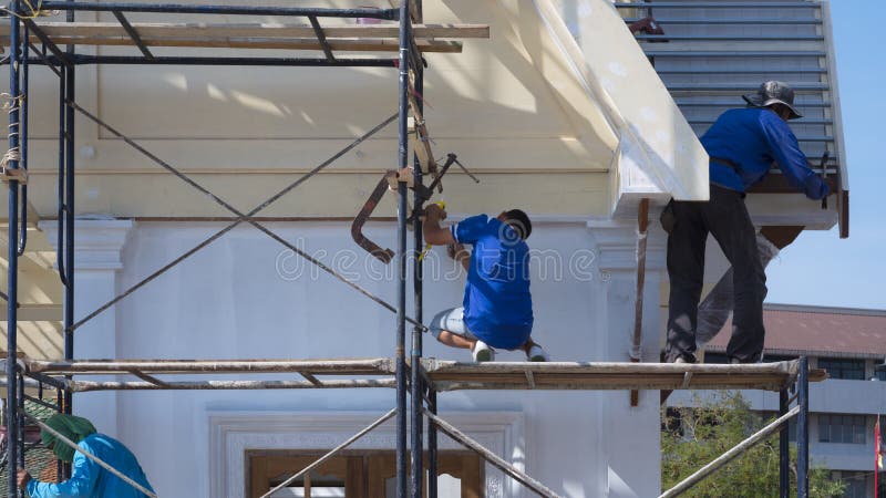 Asian Builder Workers with Work Tools on Scaffolding are Working To ...