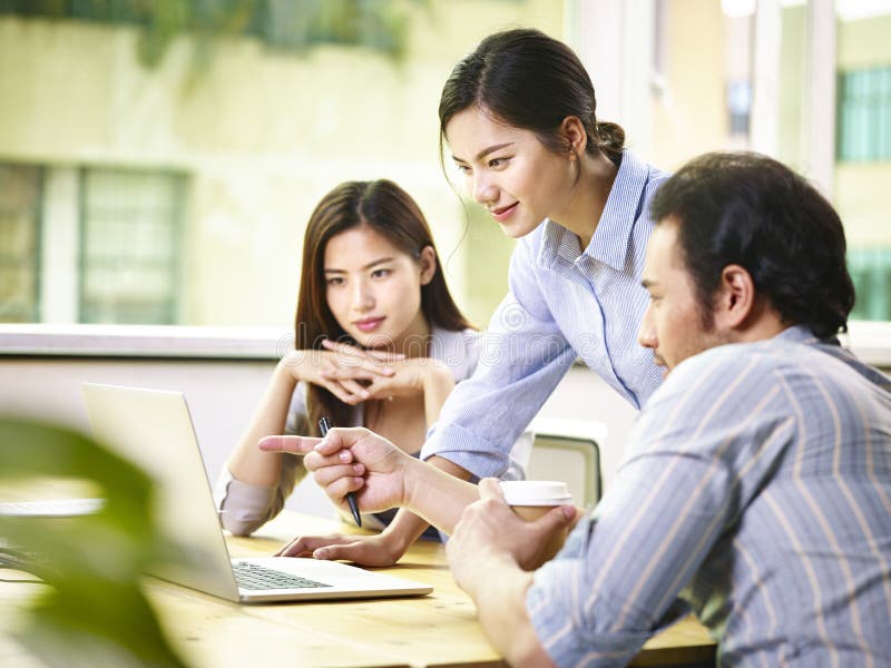 Asian Business Executives Working Together in Office Stock Image ...