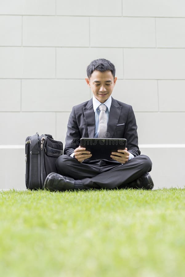 Asian Business Male Using Portable Computer on Park of City Stock Photo ...