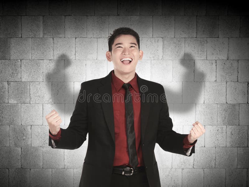 Asian Business Man Casting a Strong Man Shadow Stock Image - Image of ...