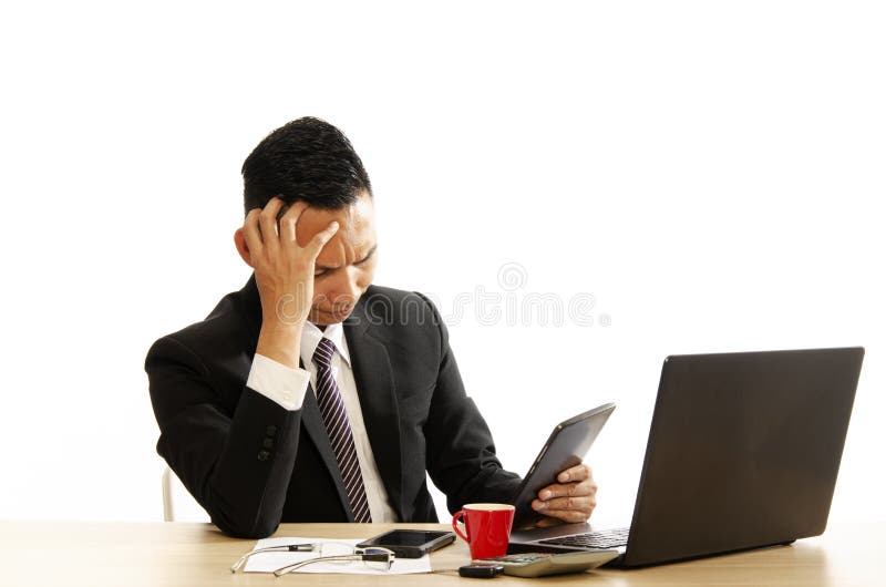 Asian Business Man Looking into His Tablet Computer and Having Headache ...