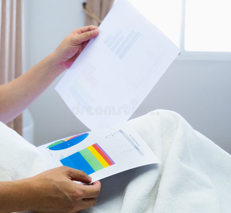 Asian Business Man Open Paper Chart or Graph at Home Stock Image ...