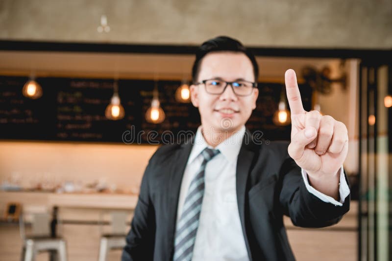 An Asian Business Man is Pointing with Left Hand. Stock Photo - Image ...