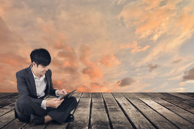 Asian Business Man Using Pad and Sit on Ground Stock Image - Image of ...