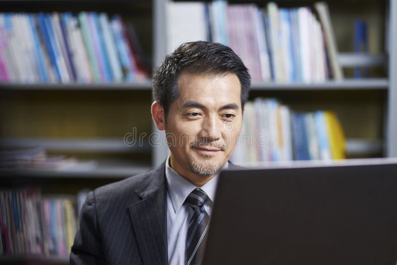 Asian Business Man Working in Office Using Laptop Stock Photo - Image ...