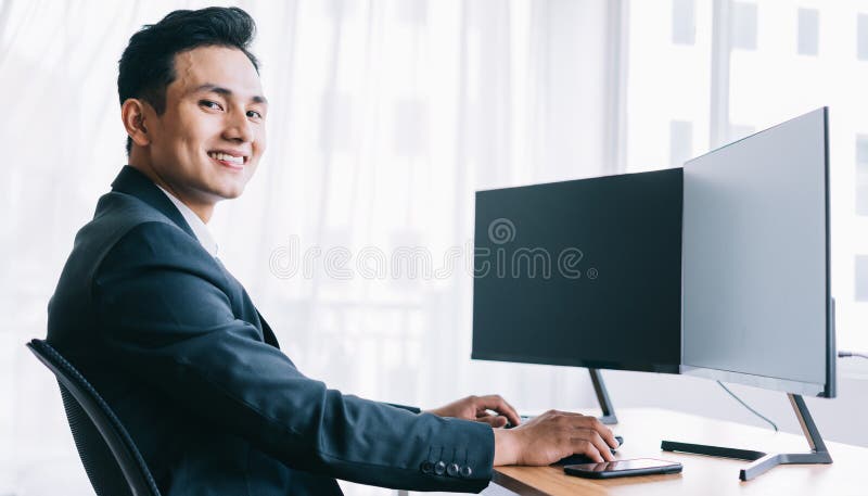 Asian Business People are Focused on Working. a Computer with Two Blank ...