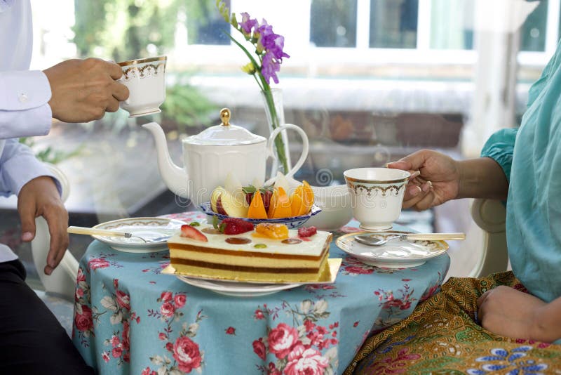 Asian Business People Having Tea and Cake and Fresh Fruit Stock Photo ...