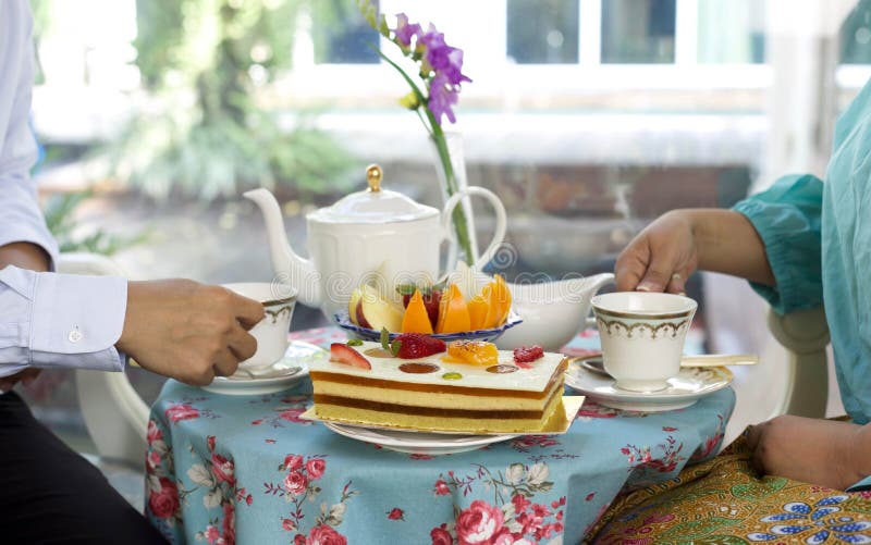 Asian Business People Having Tea and Cake and Fresh Fruit Stock Photo ...