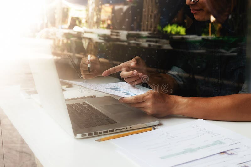 Asian Business Woman Manager Analyzing Datum in Charts and Typing on ...