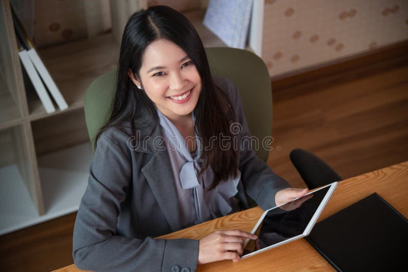Asian Business Woman Using Tablet Computer at Home Office Stock Photo ...