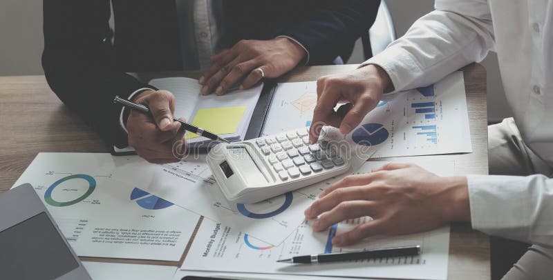 Asian Businessman or Accountant Working Pointing Graph Discussion and ...