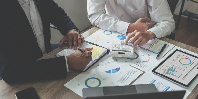 Asian Businessman or Accountant Working Pointing Graph Discussion and ...