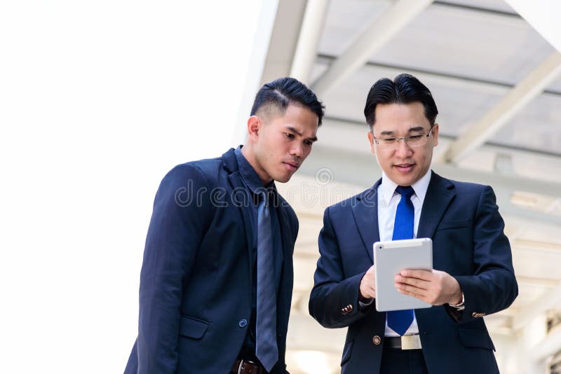 Two Asian Businessman Has Talking for Business Vision. Stock Image ...