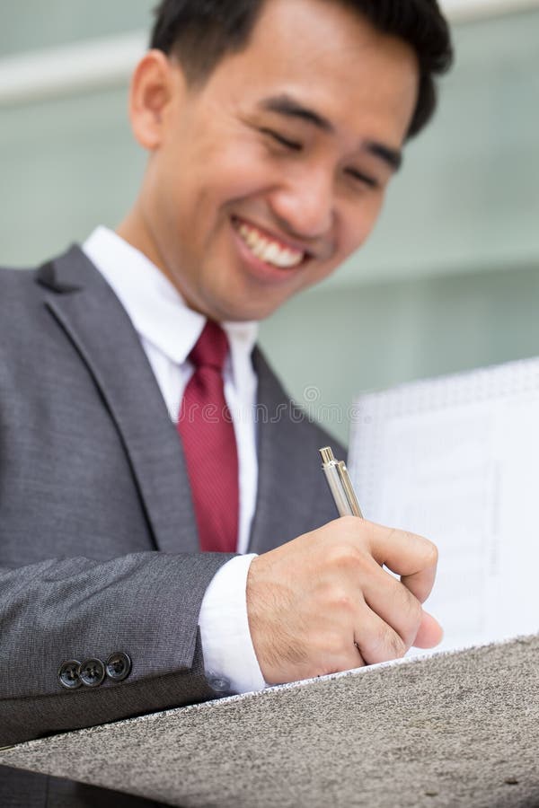 Asian Businessman Signing a Document Stock Image - Image of hand ...