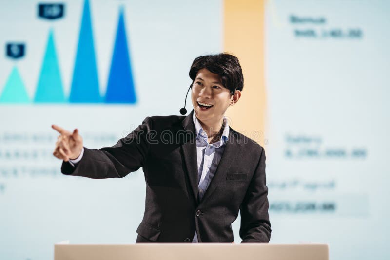 Asian Businessman Stands on Stage for Business Presentation Stock Image ...