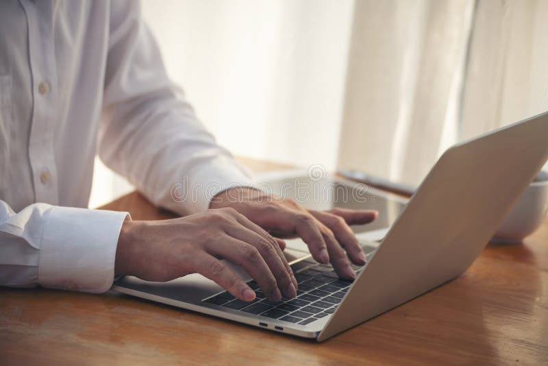 Asian Businessman Using Laptop at Office Desk. Man Hands Typing ...