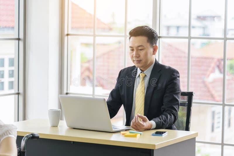 Asian Businessman Using Laptop at Office Desk. Man Hands Typing ...