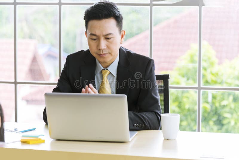 Asian Businessman Using Laptop at Office Desk. Man Hands Typing ...