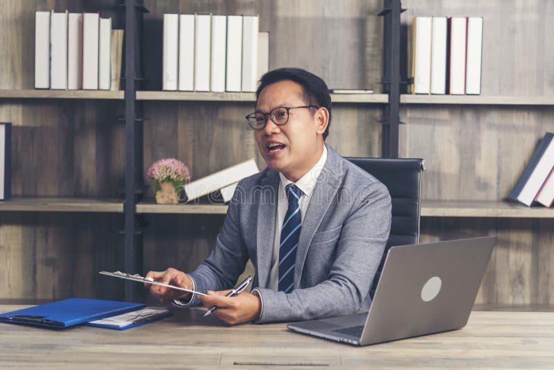 Asian Businessman Using Laptop at Office Desk. Man Hands Typing ...