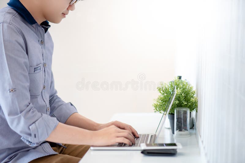 Asian Man Using Laptop Computer at Home Office Stock Image - Image of ...