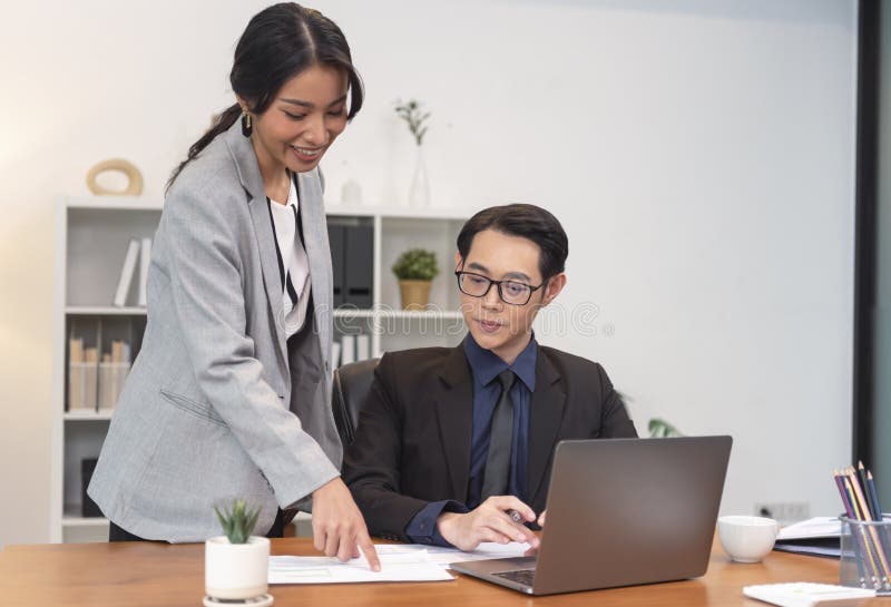 Asian Businesspeople Talk Project Strategy at Office Meeting Room ... Asian Businesspeople Talk Project Strategy at Office Meeting Room ...