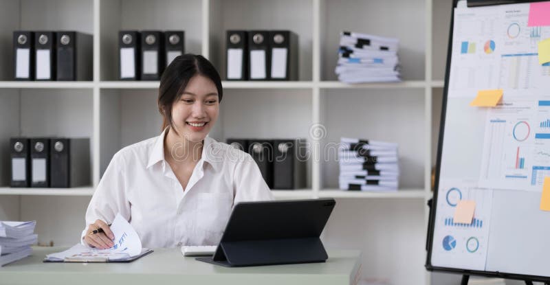 Asian Businesswoman Using Laptop Computer and Working at Office with ...