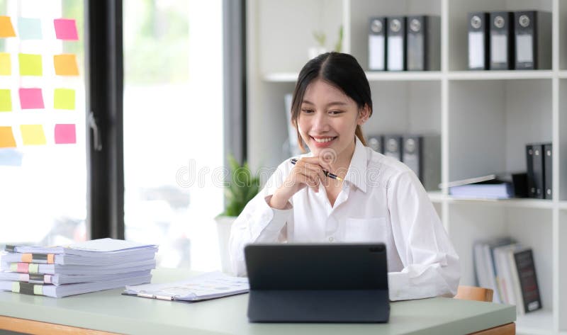 Asian Businesswoman Using Laptop Computer and Working at Office with ...