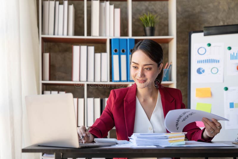 Asian Businesswoman Using Laptop Computer and Working at Office with ...