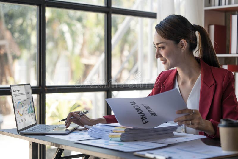 Asian Businesswoman Using Laptop Computer and Working at Office with ...