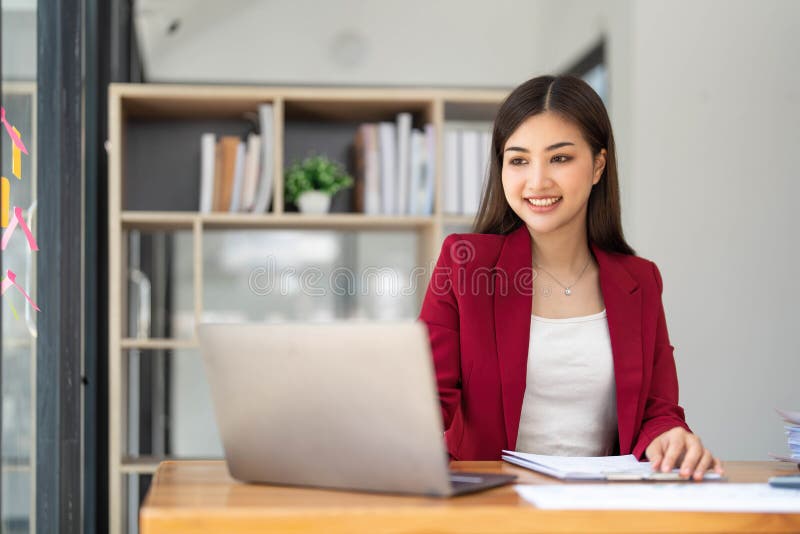 Asian Businesswoman Using Laptop Computer and Working at Office with ...