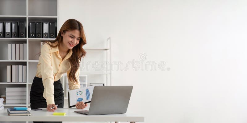 Asian Businesswoman Using Laptop Computer and Working at Office with ...