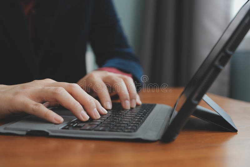 Asian Businesswoman Using Laptop Computer and Working at Office with ...
