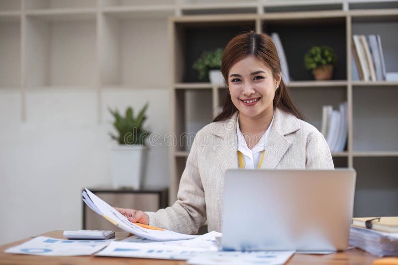 Asian Businesswoman Using Laptop Computer and Working at Office with ...