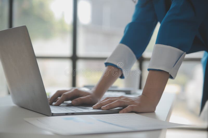 Asian Businesswoman Using Laptop Computer and Working at Office with ...