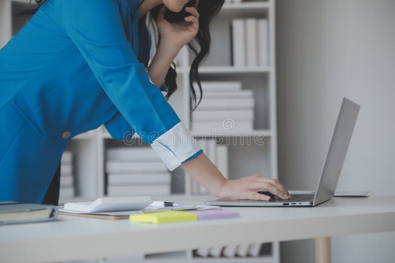 Asian Businesswoman Using Laptop Computer and Working at Office with ...