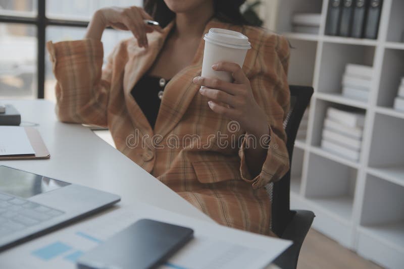 Asian Businesswoman Using Laptop Computer and Working at Office with ...