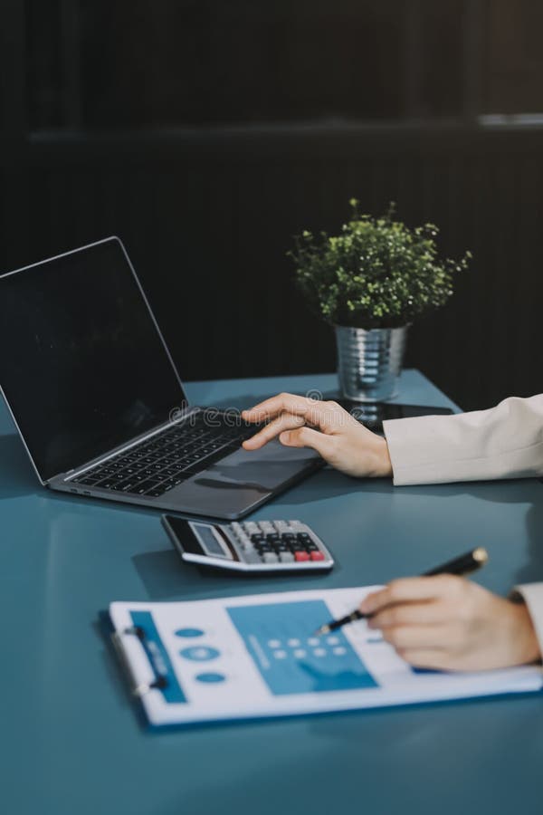 Asian Businesswoman Using Laptop Computer and Working at Office with ...