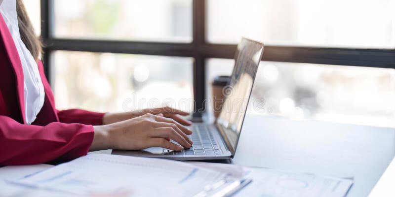 Asian Businesswoman Using Laptop Computer and Working at Office with ...