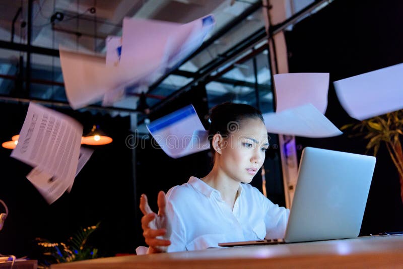 Asian Businesswoman Working on Laptop and Throwing Documents Stock ...