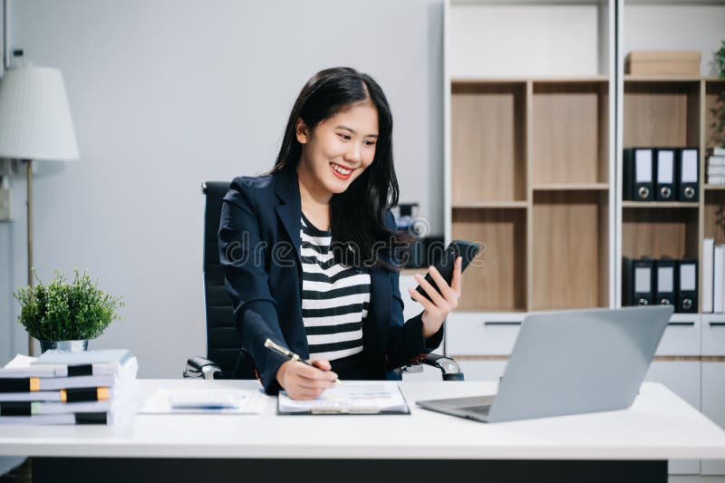 Asian Businesswoman Working in the Office with Working Notepad, Tablet ...