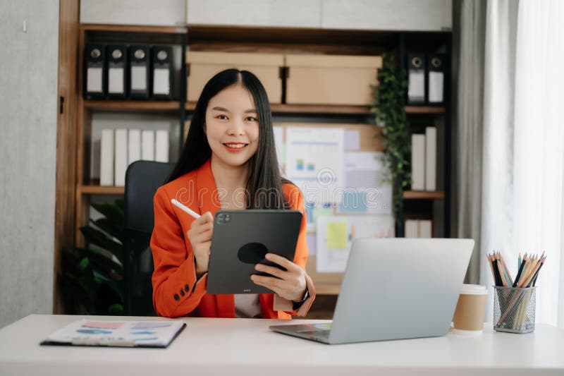 Asian Businesswoman Working in the Office with Working Notepad, Tablet ...